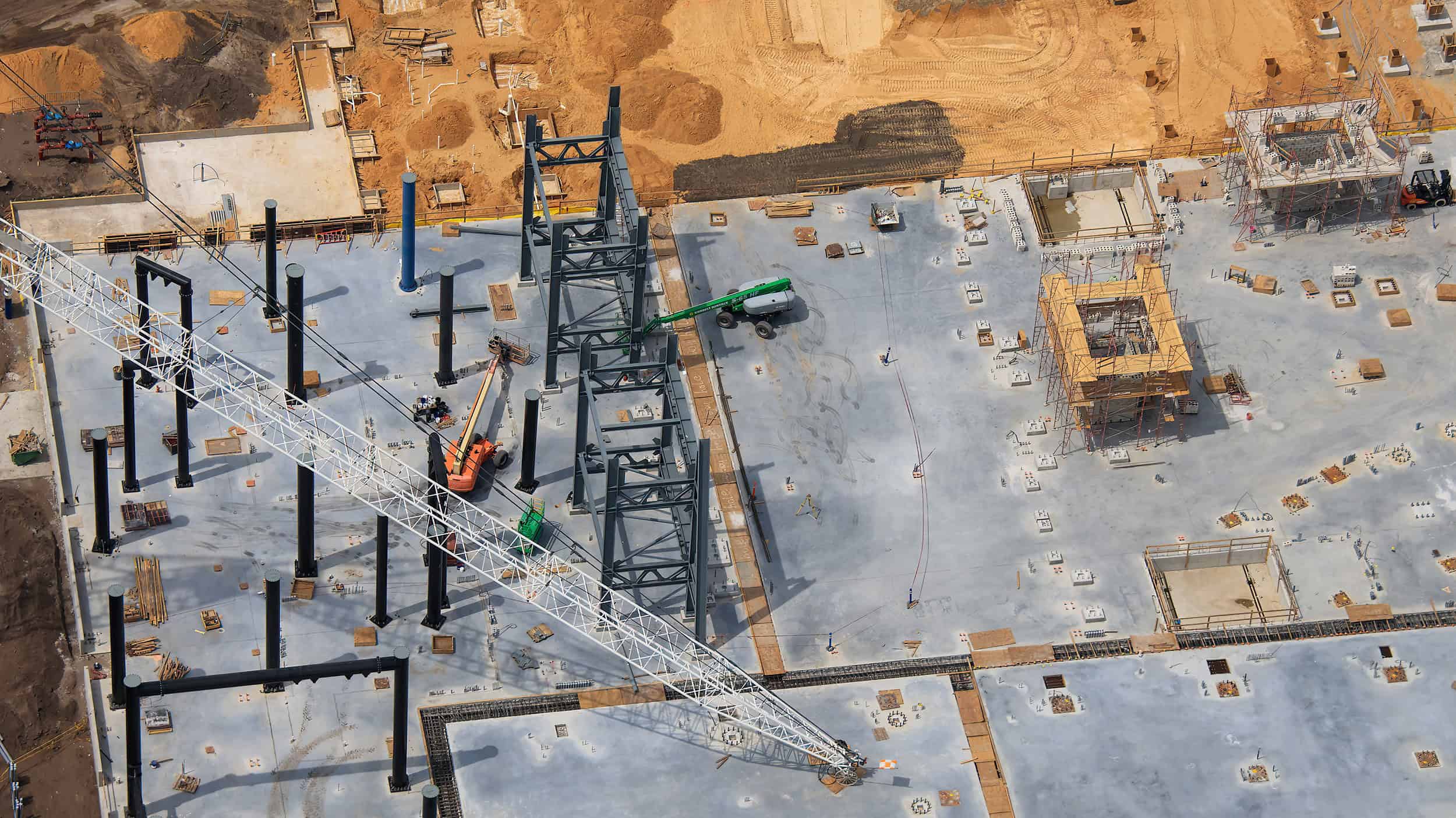 Aerial Photos Reveal Structures Rising for Monsters Inc. Door Vault Coaster